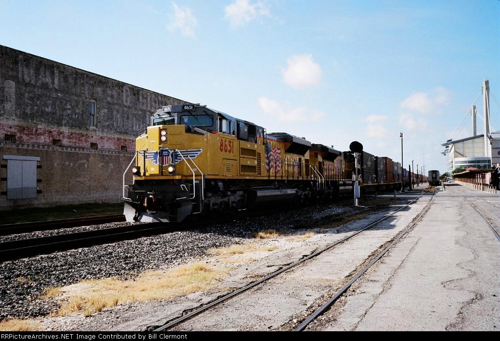 UP 8651 Passing Commerce St. and the AlamoDome.